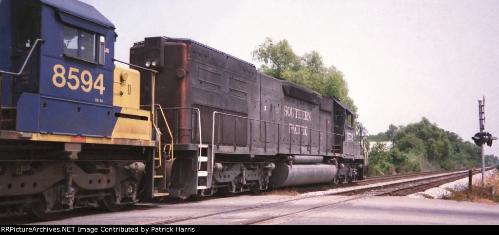 SP 8538 SD40T-2 and CSX 8594 SD50 take an intermodal train eastbound out of CSX Gentilly Yard in ...